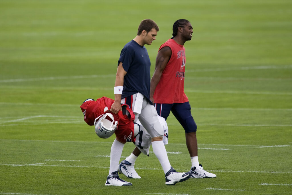 Why Randy Moss 'sneaked' into Tom Brady's hotel before joining New ...